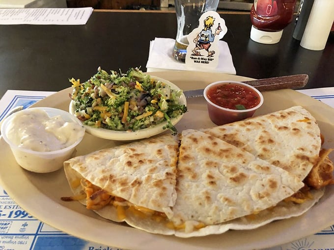 A quesadilla and broccoli slaw having the most delicious conversation on a plate. Your taste buds want to join in.
