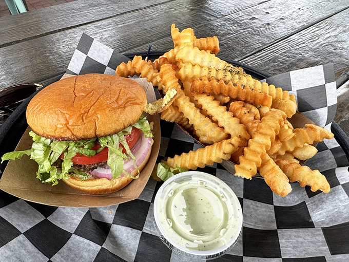 A burger and seasoned fries, presented without pretense. In a world of food fads, this is timeless comfort.