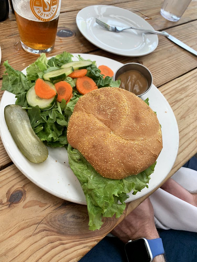 A burger that doesn't need a tower of toppings to impress, paired with a salad bright enough to make vegetables feel like more than an obligation.