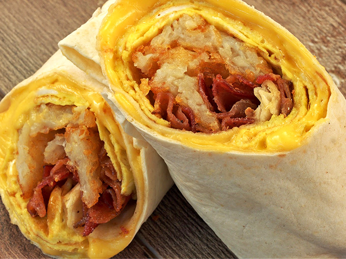 Breakfast burritos sliced to reveal their secrets&mdash;eggs, meat, and cheese wrapped like precious gifts waiting to be unwrapped by your taste buds.