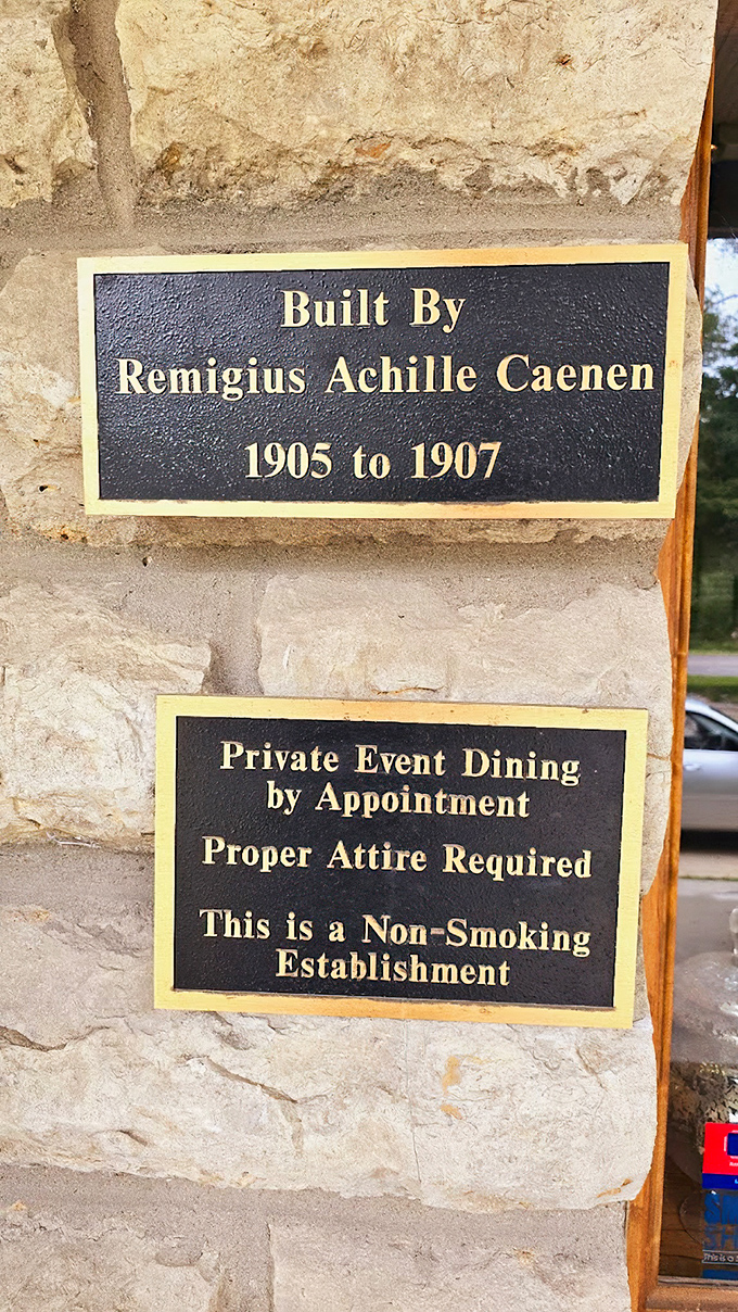 The castle's birth certificate in bronze&mdash;proof that Remigius Achille Caenen wasn't just building a home but creating a legacy in limestone.