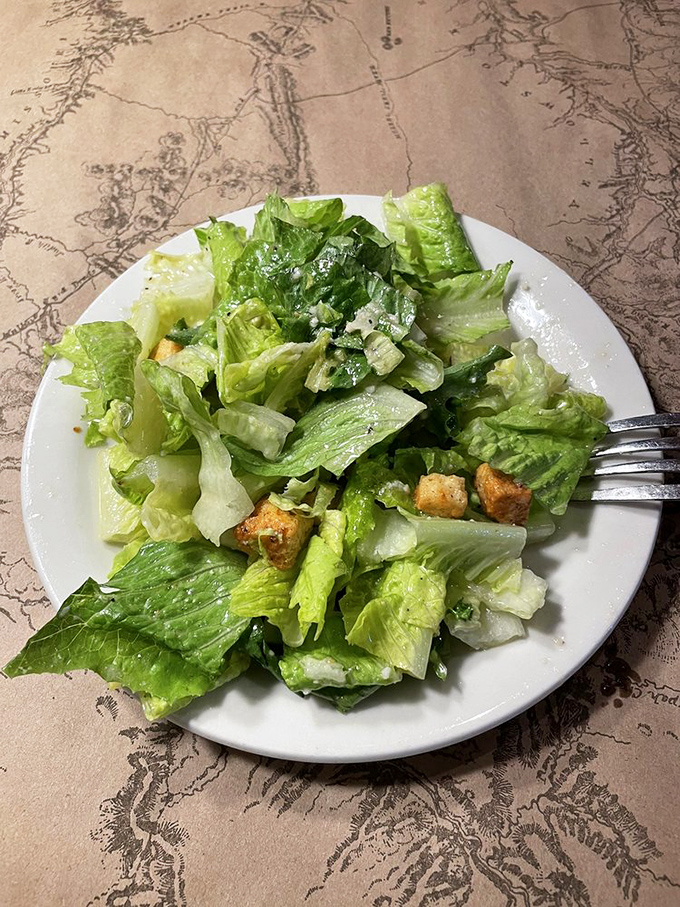Even the Caesar salad shows up dressed to impress, with crisp romaine and house-made croutons that put store-bought versions to shame.