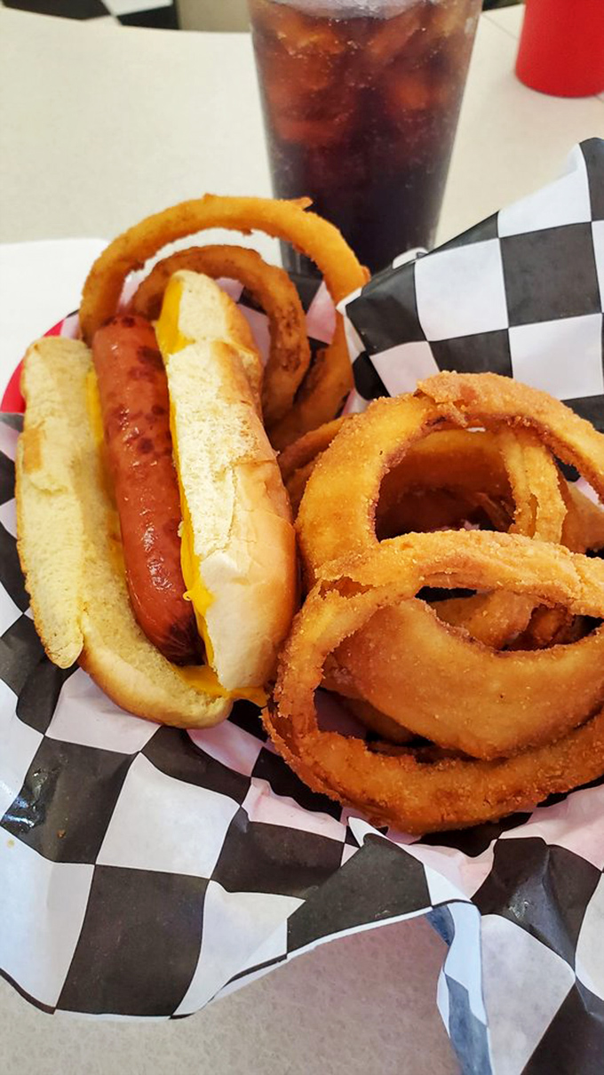 This classic combo of cheese dog and onion rings proves that sometimes the best culinary innovations happened decades ago and need no improvement.
