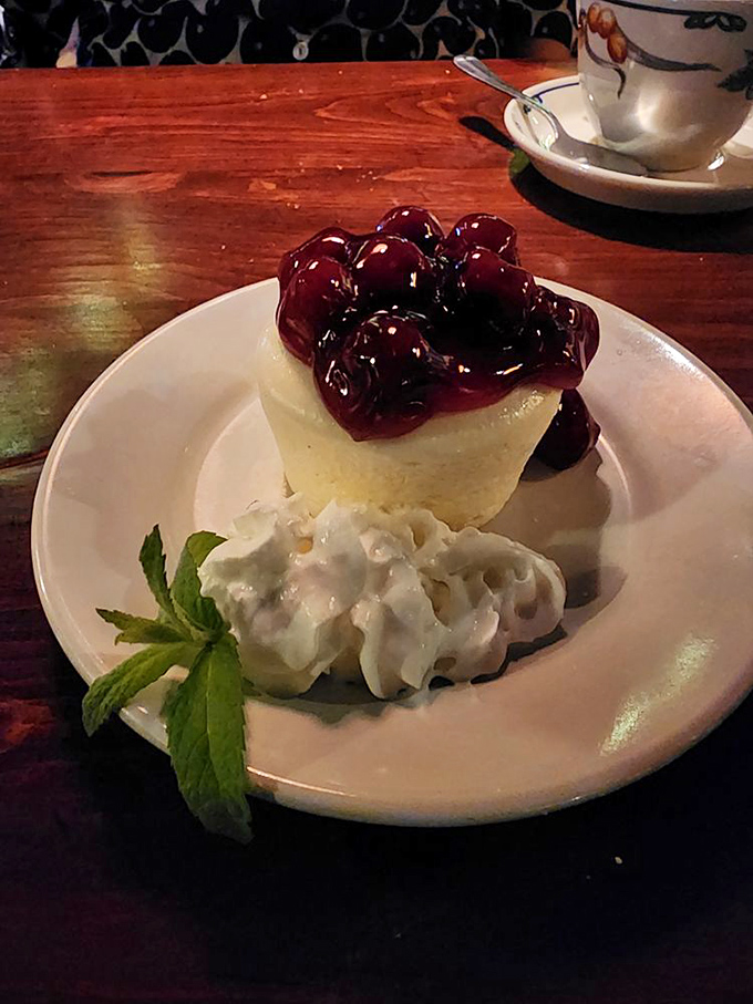 Cherry cheesecake that makes you consider skipping the seafood next time. That fresh mint garnish isn't just showing off&mdash;it's preparing you for greatness.