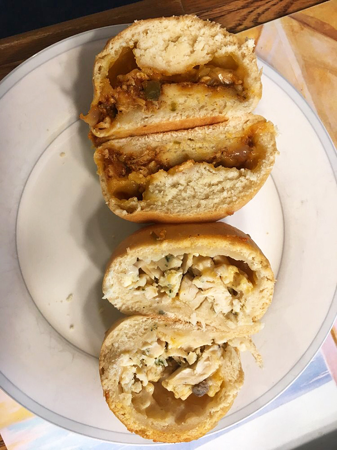 A cross-section view that reveals the generous filling-to-dough ratio. These kolaches understand that skimping on fillings is a culinary crime.