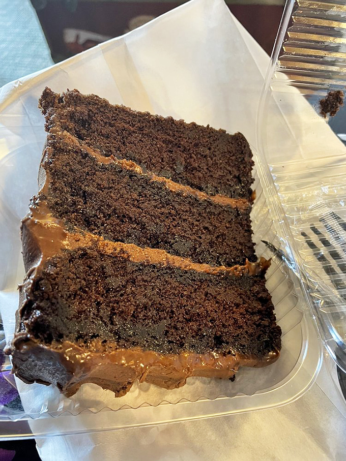 Chocolate cake so moist it should have its own fan club. Three layers of proof that dessert is not an afterthought here.