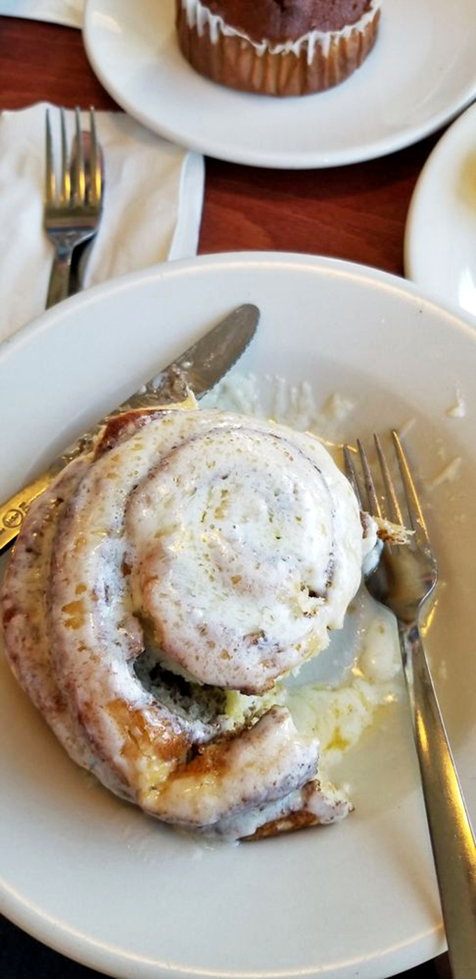 Not just any cinnamon roll&mdash;a spiral-bound love letter to your taste buds. The icing isn't drizzled; it's cascading like a sugary waterfall of joy.