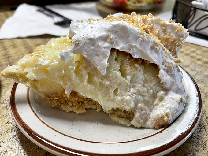 Coconut cream pie with meringue so high it needs its own zip code. The graham cracker crust is just showing off at this point.