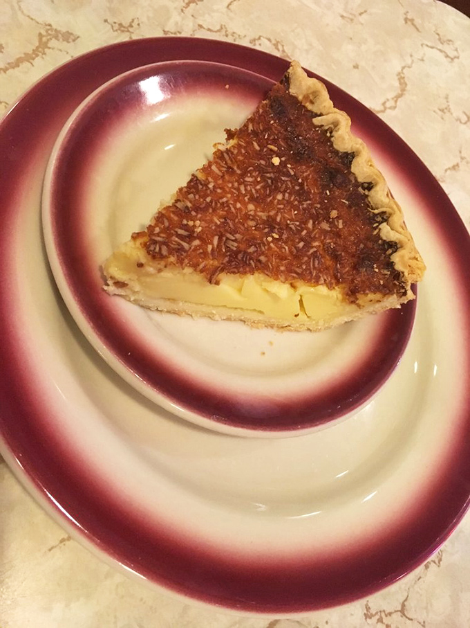 Coconut custard pie that makes you wonder why we ever complicated dessert with deconstructed this or foam-infused that. Simple perfection on a plate.