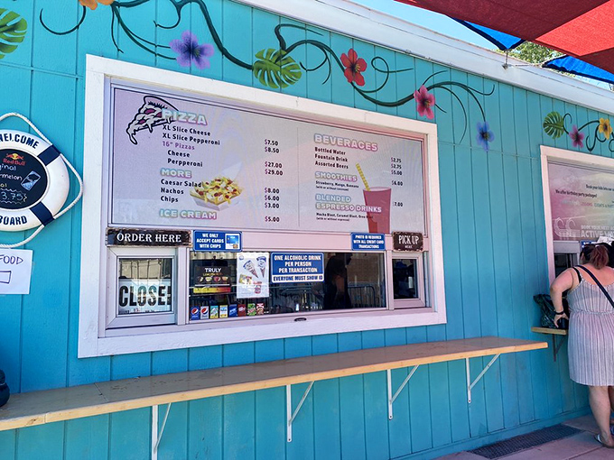The snack bar menu offers exactly what you crave after aquatic exertion: pizza, ice cream, and the sweet validation that calories don't count on vacation days.