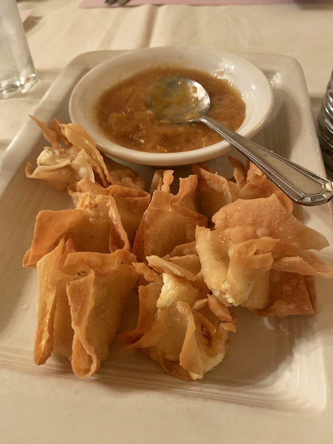 These aren't just appetizers; they're edible origami with a side of dipping sauce that'll make you forget your table manners.