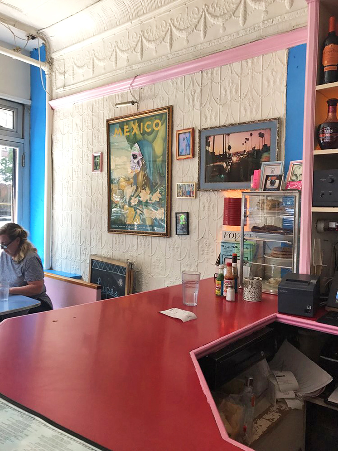 Pink and blue counter details pop against classic white walls &ndash; Lupe's isn't following design trends; it's been setting its own colorful aesthetic for decades.