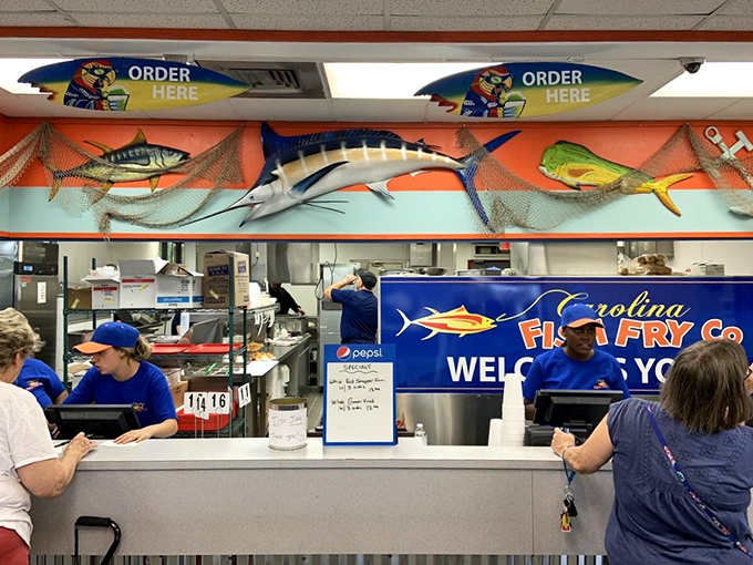 Where seafood dreams are fulfilled &ndash; the bustling counter area with mounted fish watching over the proceedings.