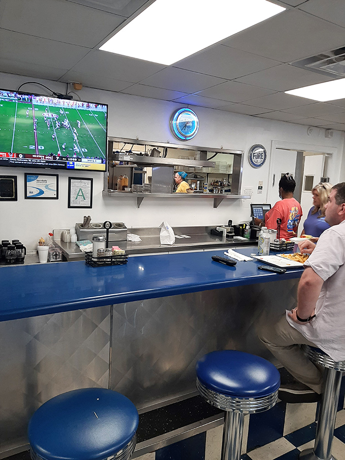 The counter where regulars become family and newcomers become regulars. That blue countertop has heard it all. 