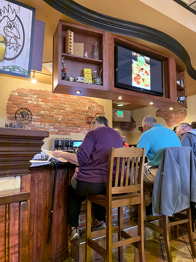 Counter seating: where solo diners become breakfast philosophers and the morning paper meets its match in steaming coffee.