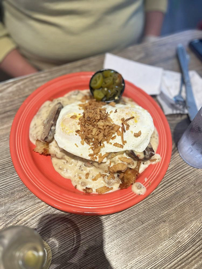 Breakfast architecture at its finest&mdash;eggs perched atop a savory foundation with crispy bits that promise textural paradise in every bite.