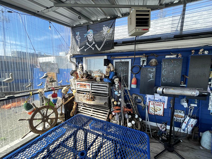 Where nautical dreams meet seafood reality&mdash;this covered seating area with its ship's wheel and pirate flag promises adventure with every meal.