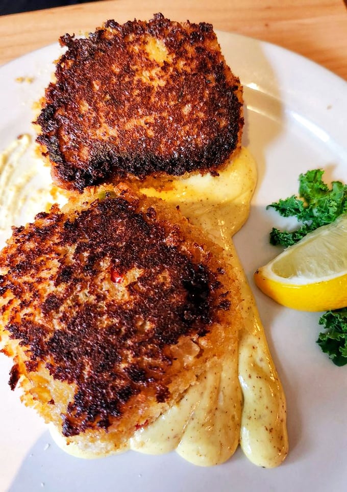 These aren't just crab cakes&mdash;they're delicate islands of seafood perfection resting on a sea of creamy sauce. Worth every mile of the journey.