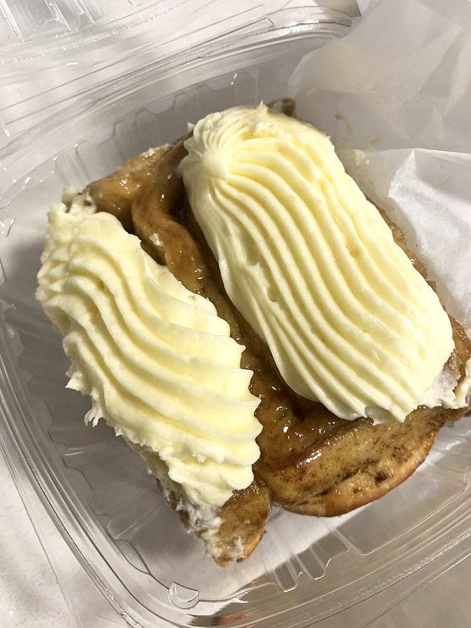 Two perfect ribbons of cream cheese icing transform this cinnamon creation into something worth setting your alarm for, even on weekends.