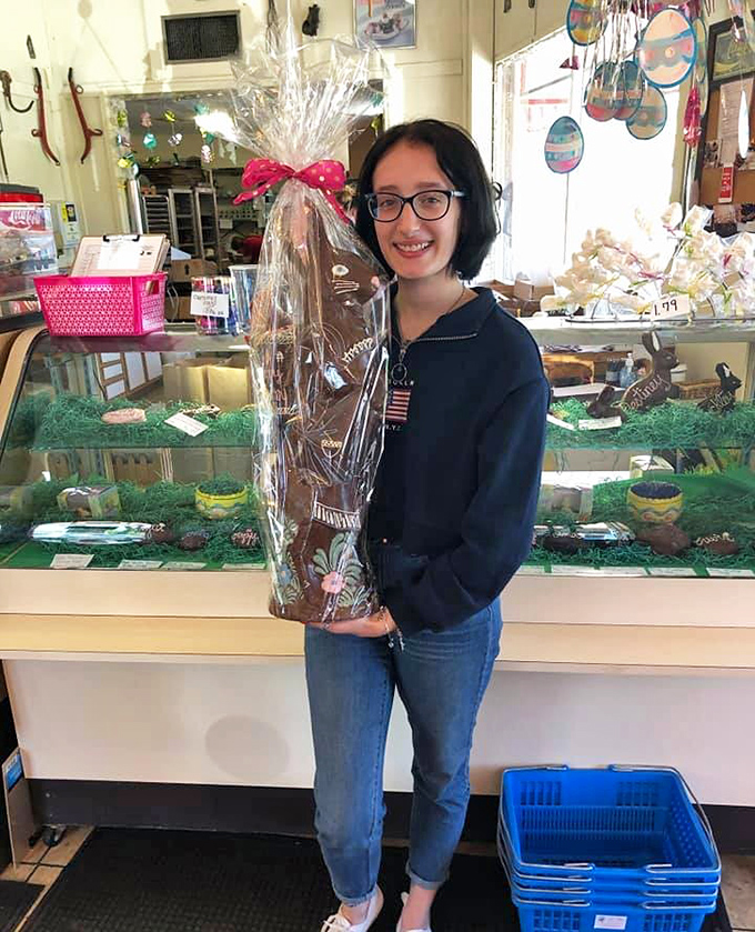 Holiday magic takes shape as a chocolate bunny finds a new home, wrapped with care and ready to become the centerpiece of someone's Easter celebration.