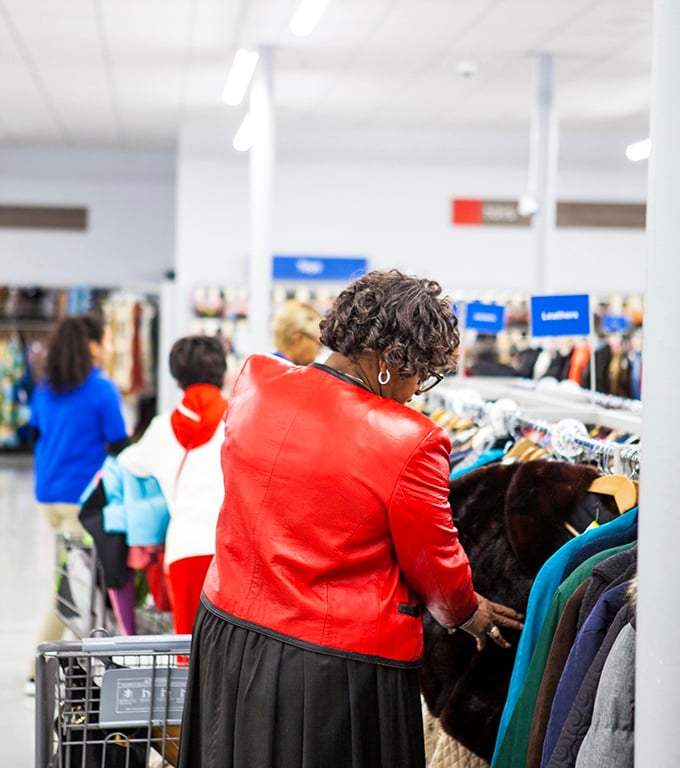 The thrill of the hunt captured in a single moment. That vibrant red jacket might be exactly what she's been searching for all season.