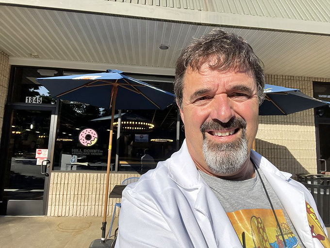 Even the most seasoned food enthusiasts can't resist documenting their Hill Donut pilgrimages. The donut logo approves from the background.