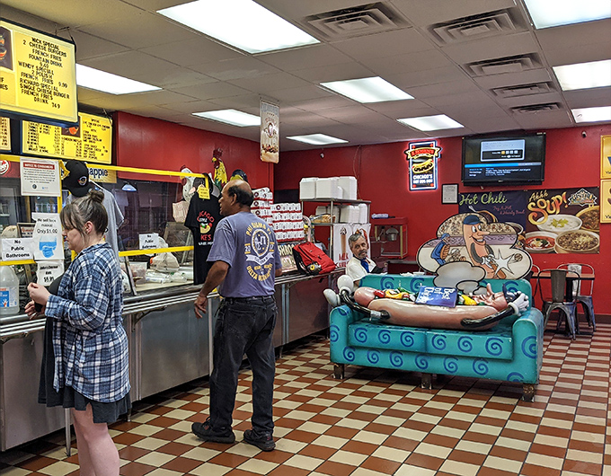 The lunchtime choreography of Jake's—where regulars and newcomers perform the daily ritual of exceptional fast food acquisition.