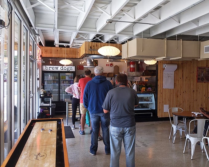 The universal language of hunger brings people together in line. Patient pilgrims awaiting their turn at the altar of handcrafted sausages.