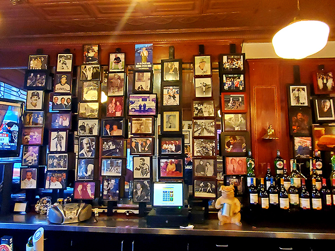 The wall of fame showcases visitors from all walks of life. In a world of digital memories, there's something magical about physical photographs.