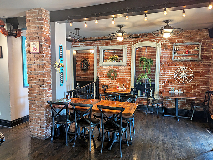 The dining room balances rustic charm with urban sophistication&mdash;brick walls, wooden tables, and string lights create an atmosphere as comforting as the food.