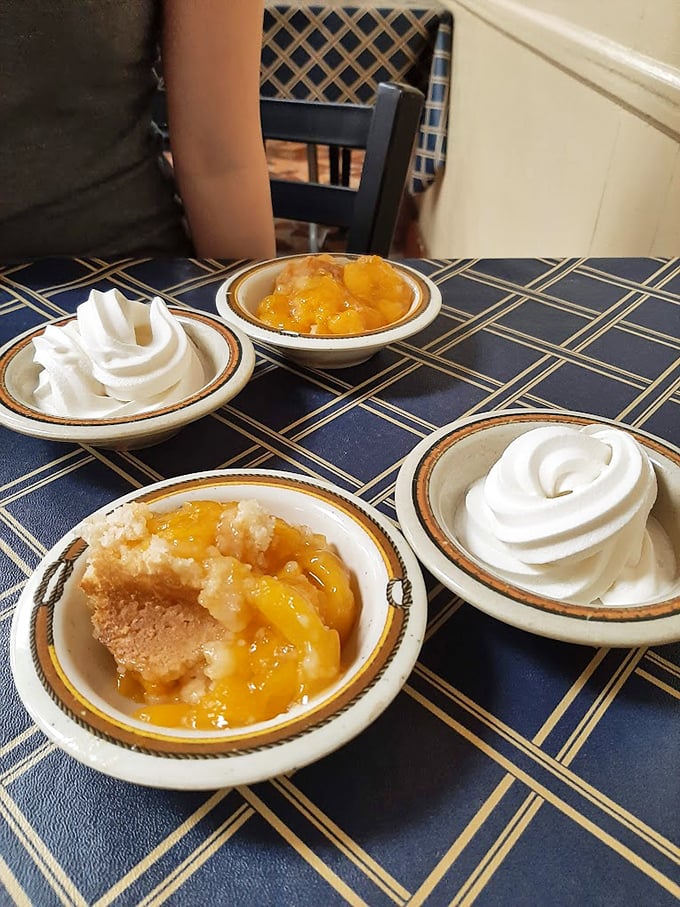 Peach cobbler and whipped cream&mdash;the dessert equivalent of a warm Southern hug. Save room or live with regret until your next visit.