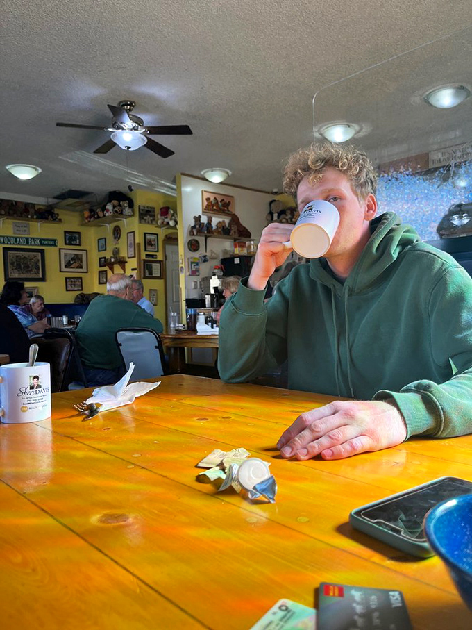 The dining room buzzes with morning energy as patrons sip from mugs that could double as soup bowls. Colorado mornings demand serious coffee.