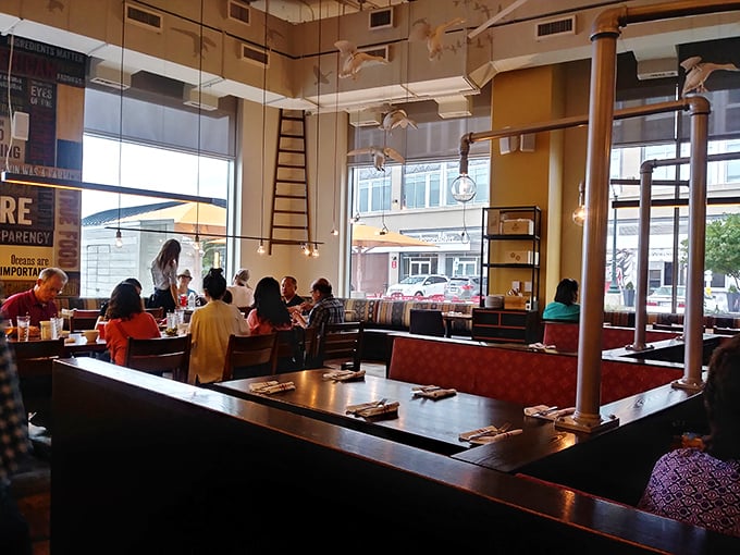 The dining room hums with the satisfied murmurs of patrons who've discovered what good food should taste like. Community through cuisine.