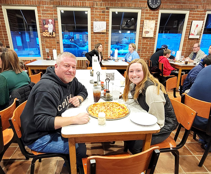 Families creating memories around the table &ndash; the true magic of pizza isn't just in the ingredients, but in the moments it inspires.