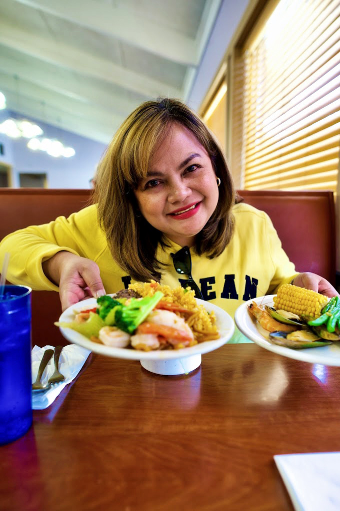 The universal language of buffet happiness&mdash;two plates, endless possibilities, and the smile that says "I'm definitely coming back for more."