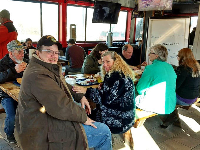 Strangers becoming friends over shared food experiences. The universal language of "mmm" needs no translation at this table.