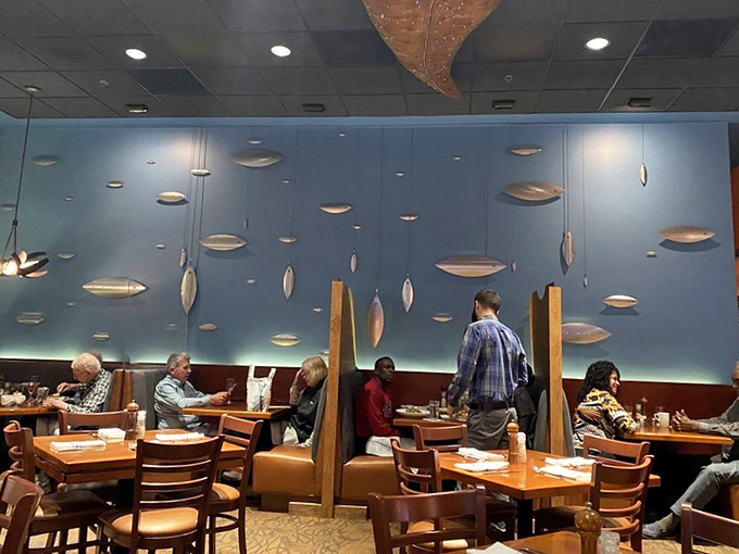 The dining room where suspended fish sculptures swim eternally above conversations about how you can't possibly eat another bite (but will).