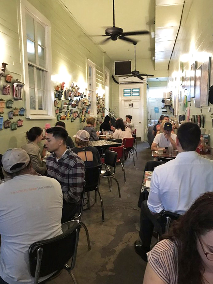 Morning conversations flourish under spinning ceiling fans, where strangers become temporary neighbors united by good taste.