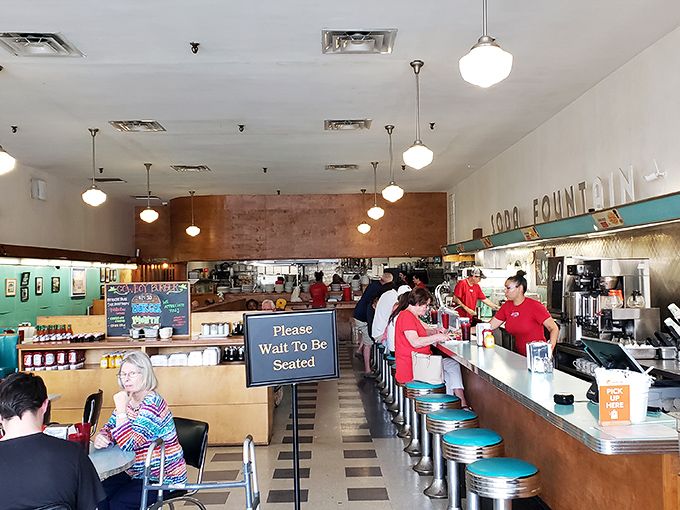 The counter seating isn't just functional&mdash;it's front-row tickets to the short-order ballet performed daily by cooks who make multitasking an art form.