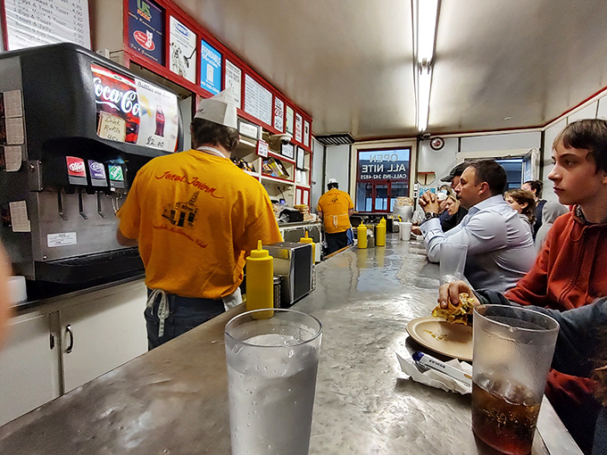 Where strangers become temporary neighbors, sharing counter space and stories while waiting for their slice of Roanoke culinary history.
