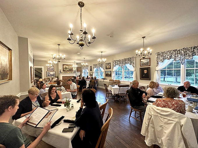 Diners bask in chandelier light and historic ambiance, experiencing the same warmth that has welcomed guests from stagecoach days to modern road-trippers.
