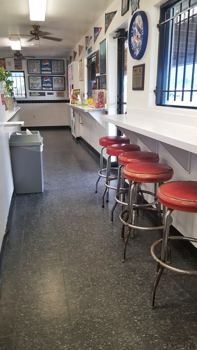 The counter where dreams come true. Red stools have supported thousands of happy customers through moments of pure hot dog bliss.