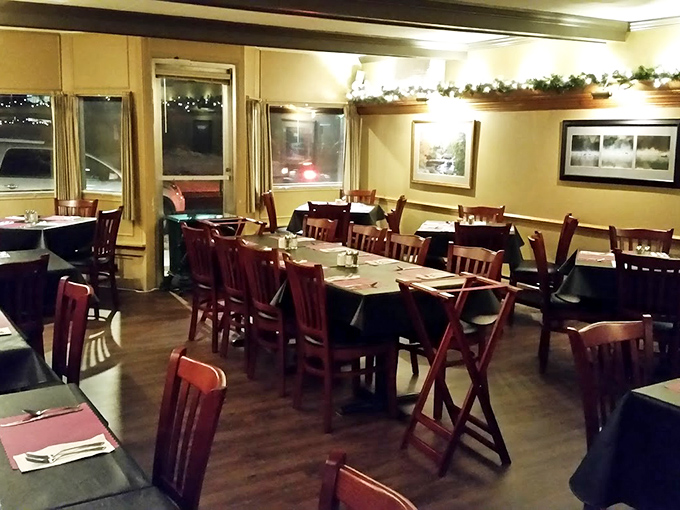 The dining room waits expectantly for the evening rush. Each wooden chair has witnessed countless first dates, anniversaries, and "just because" celebrations.
