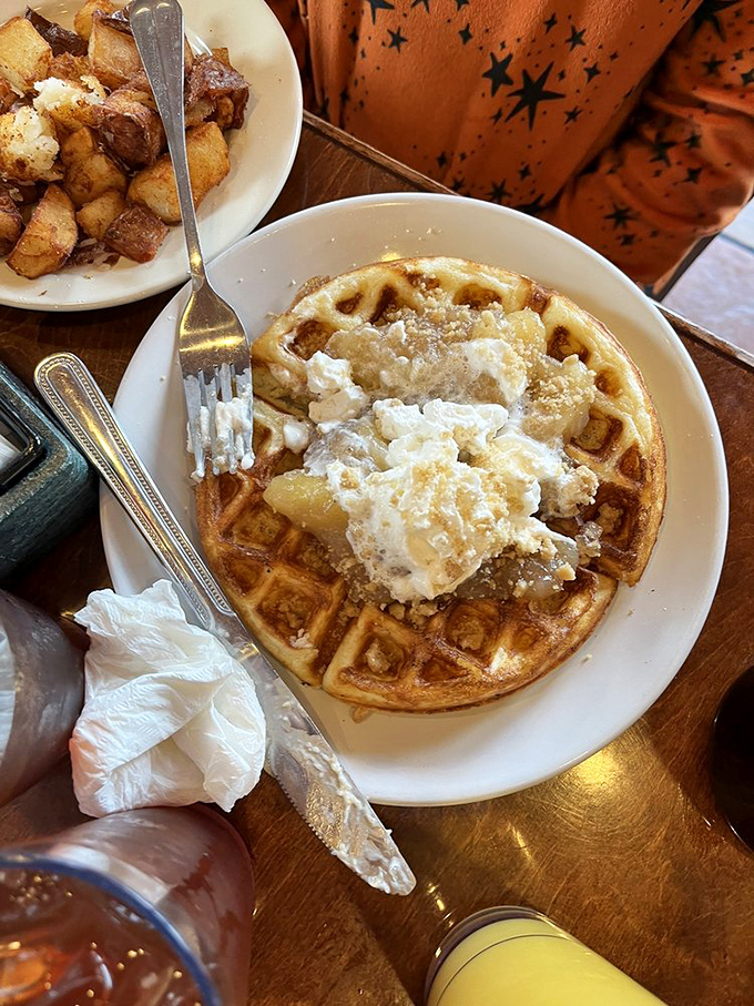 This waffle isn't just breakfast &ndash; it's dessert with an alibi, complete with apple topping and a dollop of morning joy.