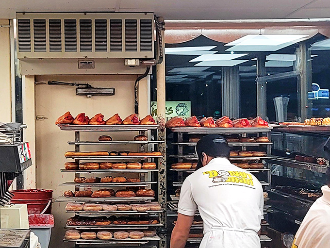 The behind-the-scenes heroes work their magic while we wait. Like donut conductors orchestrating a symphony of sugar and dough.