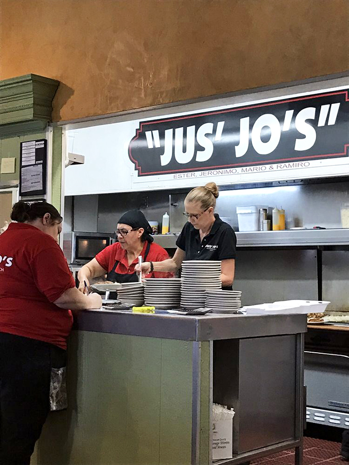 The kitchen crew works with practiced efficiency, turning out plate after plate of comfort food classics without missing a beat.