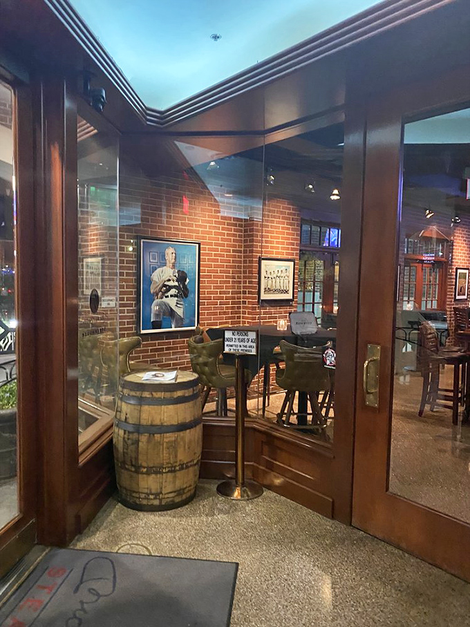 The entrance feels like stepping into baseball royalty's living room, complete with barrel table and memorabilia that tells stories of glory days.