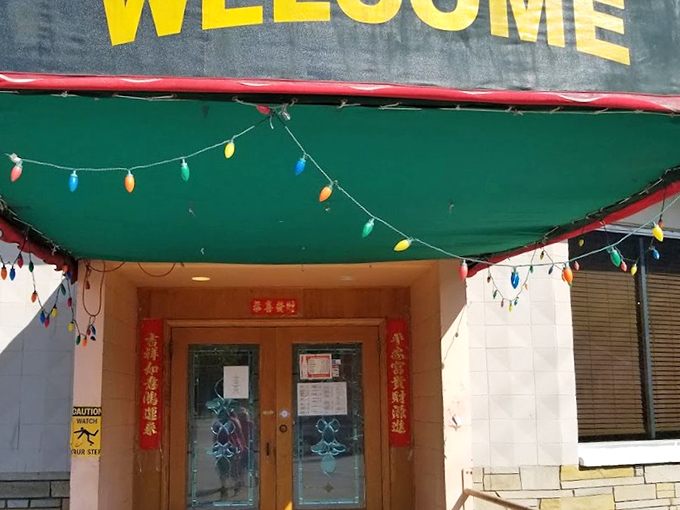 The entrance promises simple joys with no pretension&mdash;just colorful lights and a welcome sign that means exactly what it says.