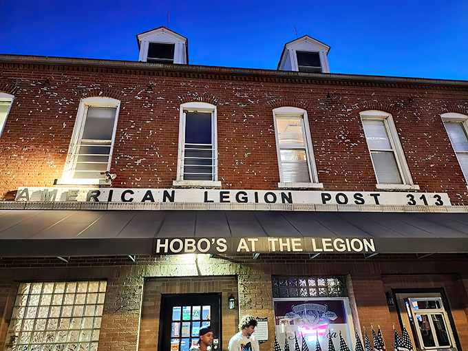 As twilight falls, Hobos at the Legion's illuminated sign becomes a beacon for hungry travelers seeking authentic American comfort food.