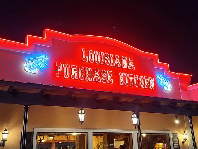 Under neon lights, Louisiana Purchase Kitchen transforms from daytime comfort to evening beacon for the hungry and hopeful.